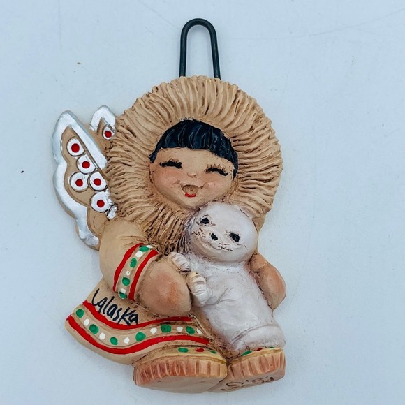 Accents | Vintage Handpainted Eskimo Angel Hugging A Seal Ornament Made ...